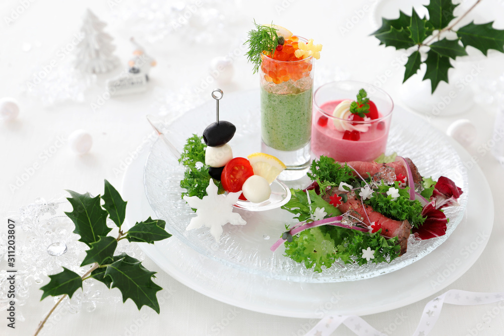 Plate of assorted festive appetizers. Avocade and spinach mousse ...