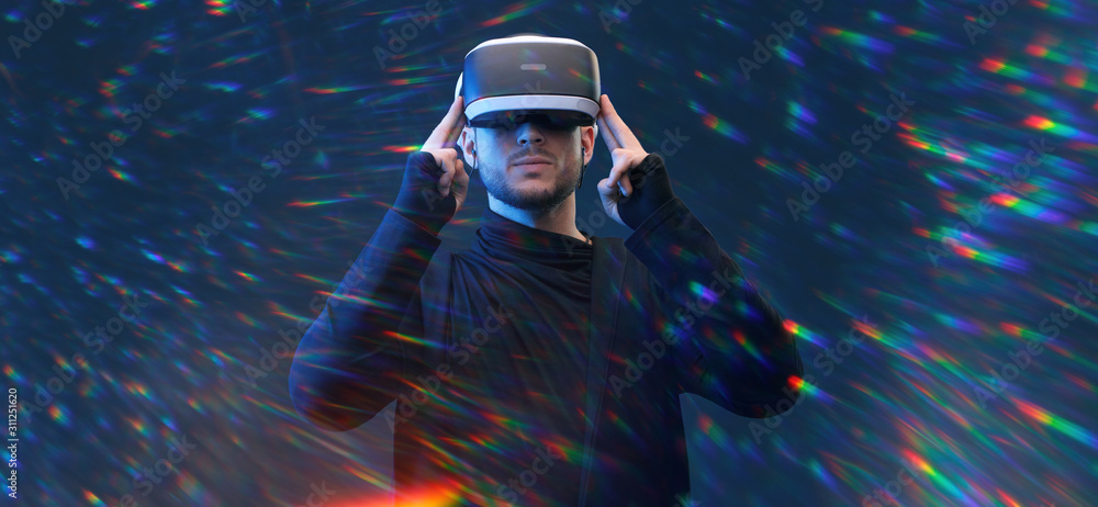 Young man on virtual reality background. Guy using VR helmet. Augmented ...