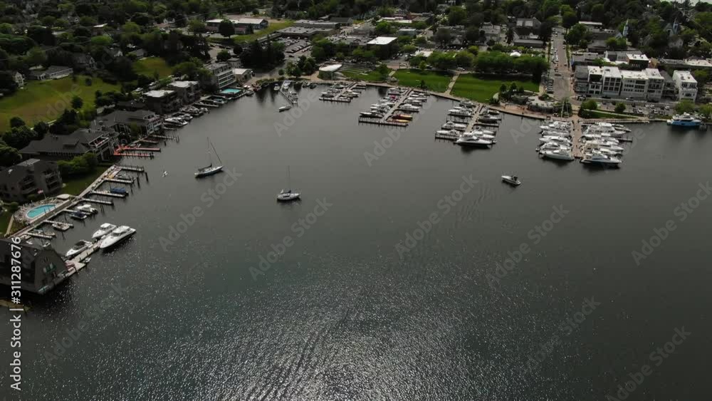 Round Lake in Charlevoix connects to Lake Michigan with boats and sail ...