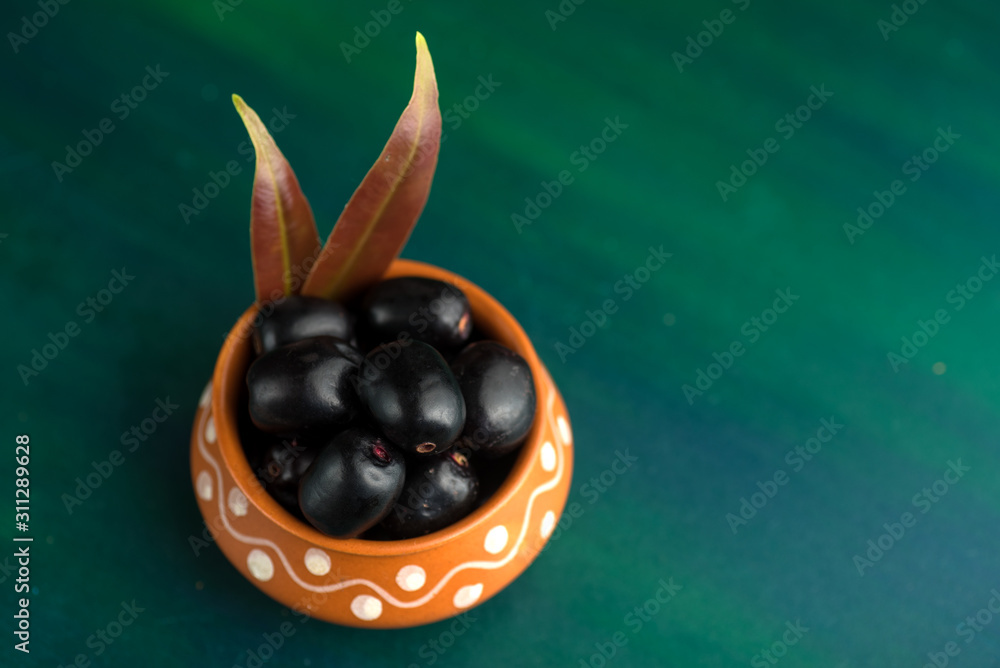 Jambolan plum or jambul or Jamun fruit, Java plum (Syzygium cumini) on ...