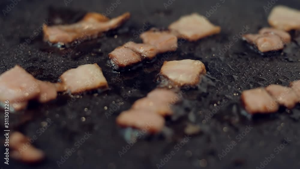 Vídeo do Stock: Frying Bacon On Pan In Slow Motion.Roasted Meat For ...