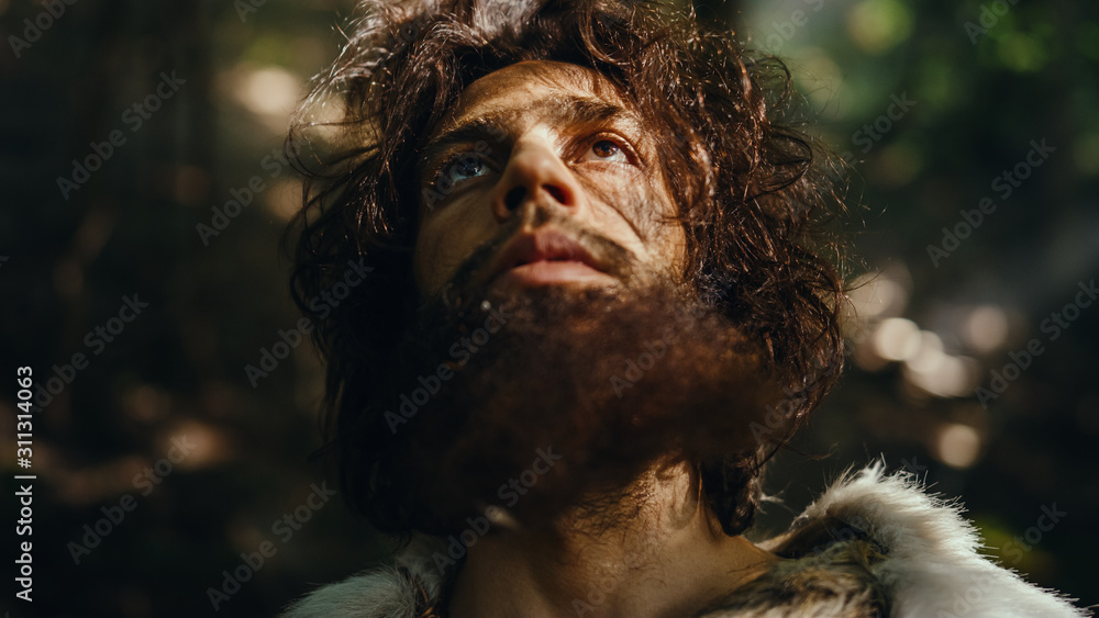 Portrait of Primeval Caveman Wearing Animal Skin Raises Hands to Heaven ...