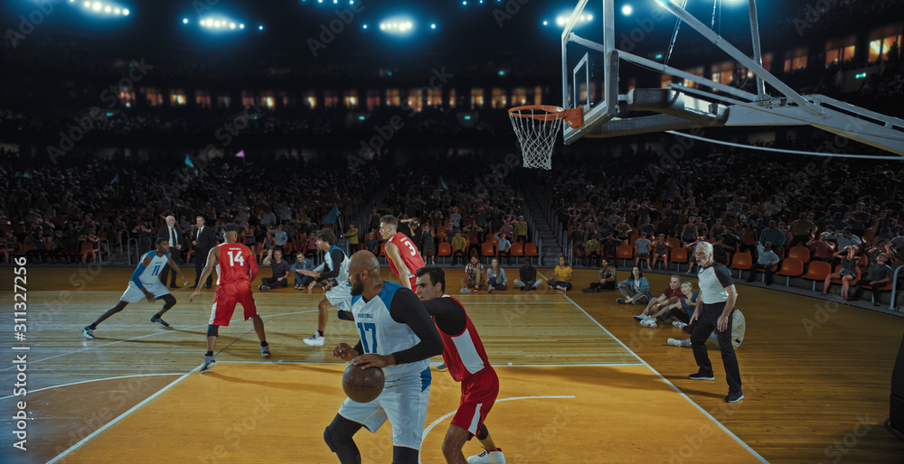 Basketball players on big professional arena during the game. Tense ...