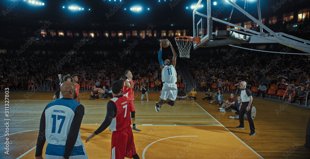Basketball players on big professional arena during the game. Tense ...