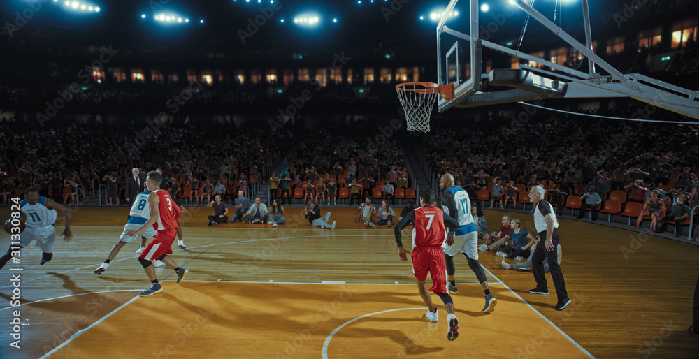 Basketball players on big professional arena during the game. Tense ...