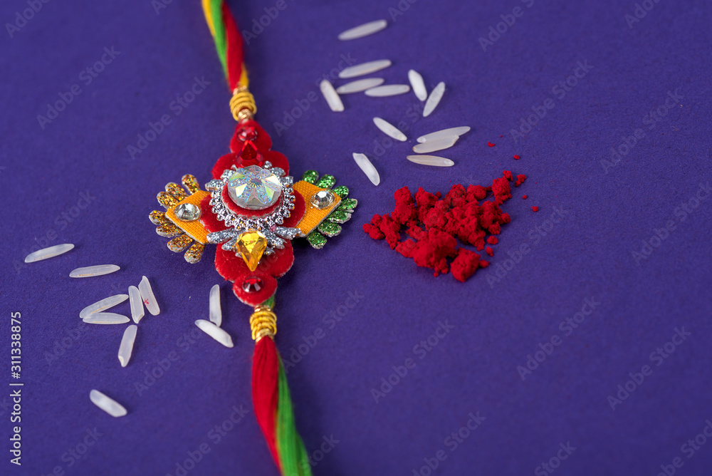 Raksha Bandhan : Rakhi with rice grains and kumkum. An Indian festive ...