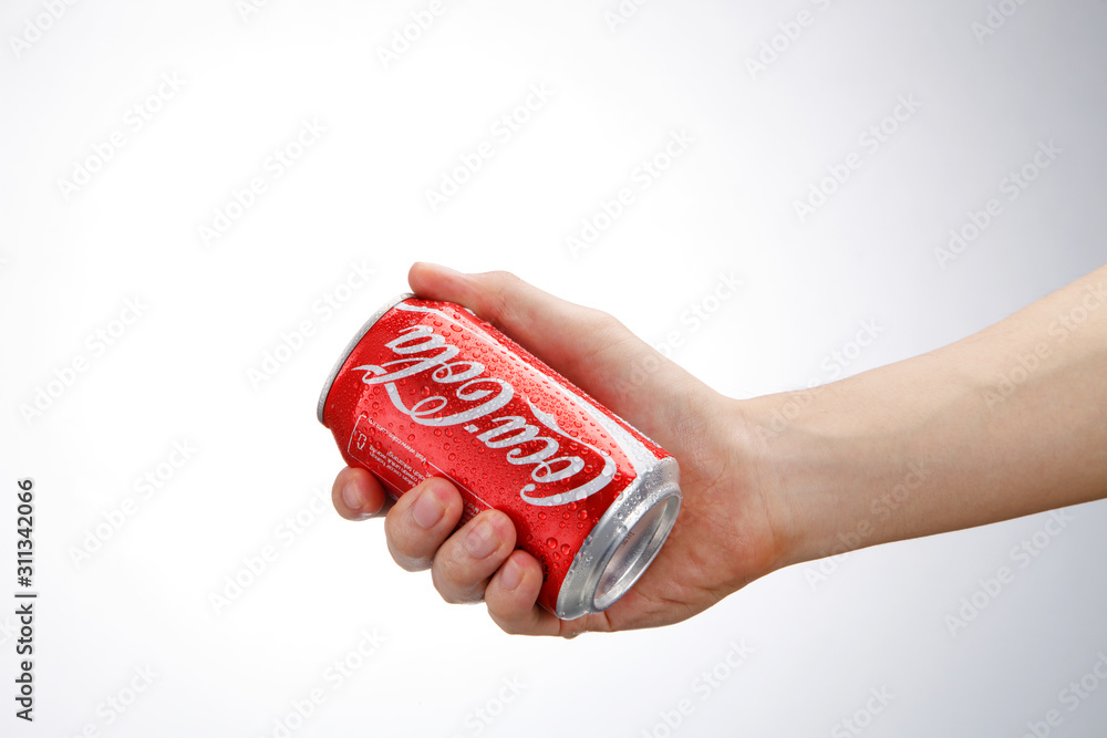 hand holding coca cola ภาพถ่ายสต็อก | Adobe Stock