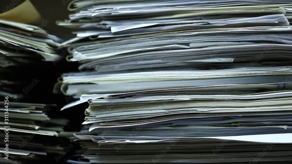 Stacks of old documents in the old archive. Brown, old data files ...