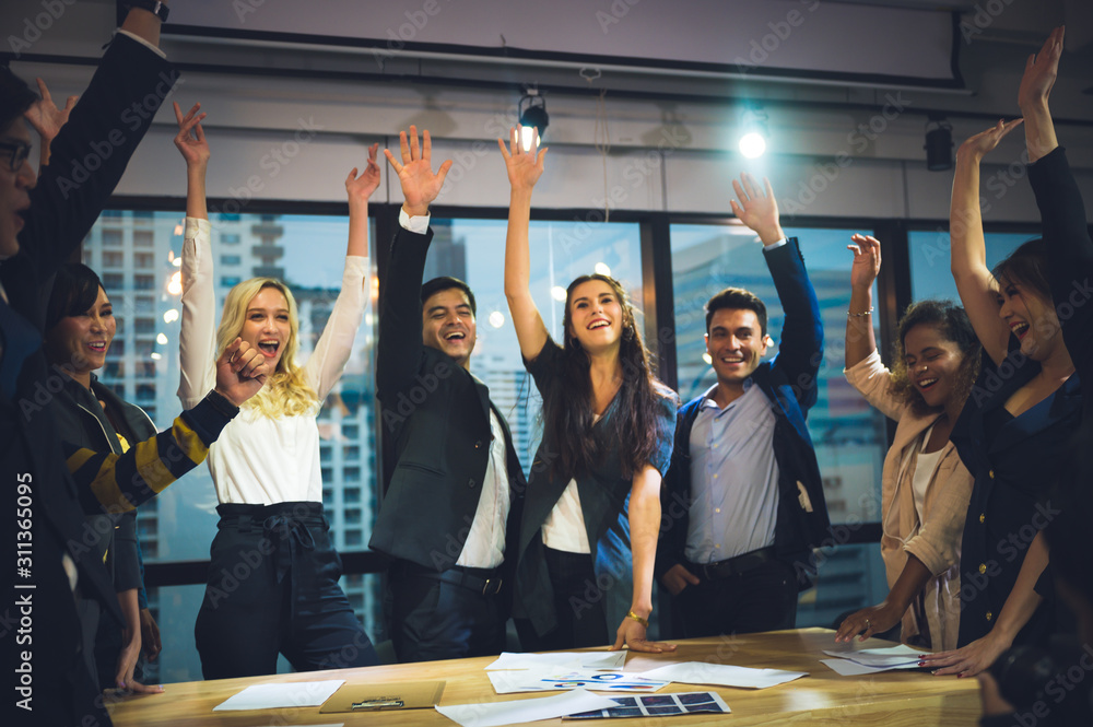 Large business team showing unity with their hands together Stock Photo ...