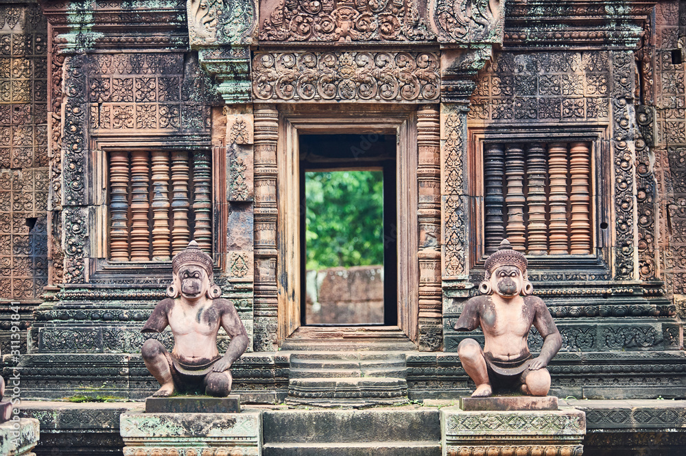 Two Khmer statues in Prasat Banteay Srei Temple. Angkor; Unesco world ...