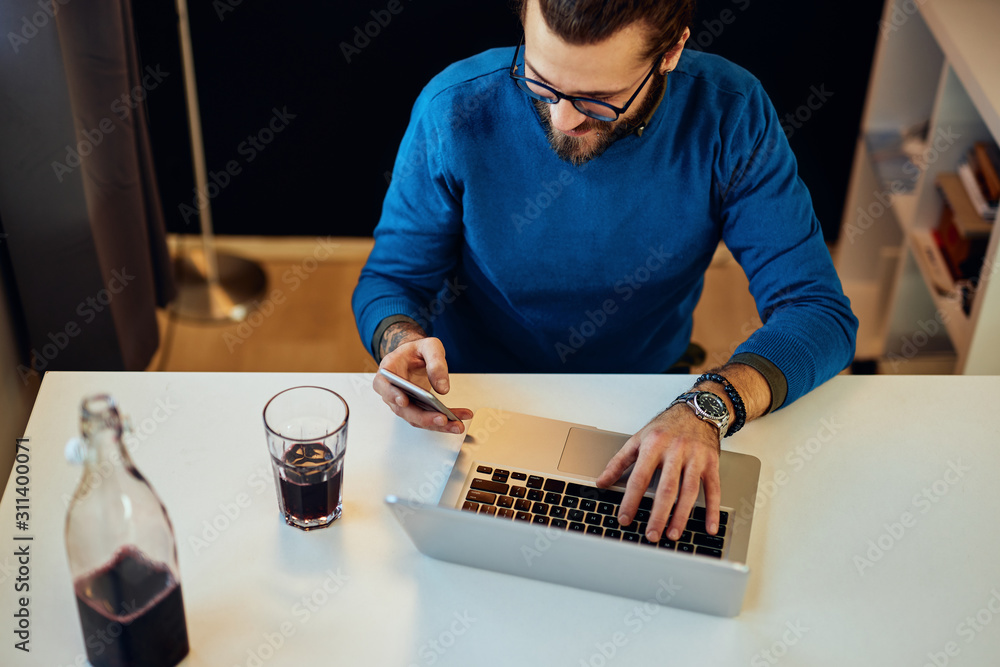 Top view of handsome caucasian bearded businessman sitting in his ...