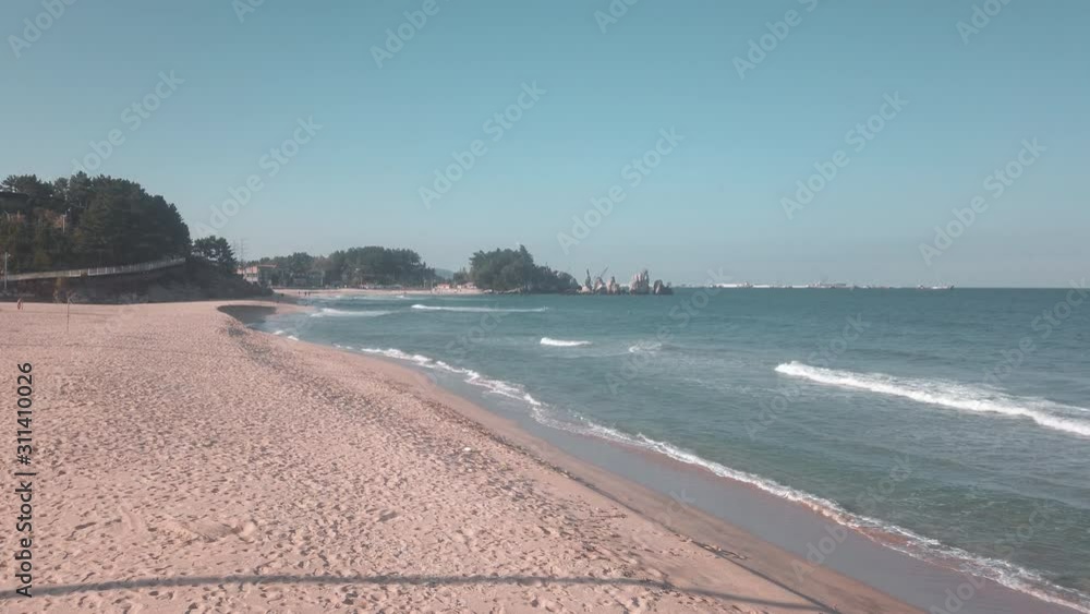 Scenic cinematic slow motion video of white sand and blue water on ...