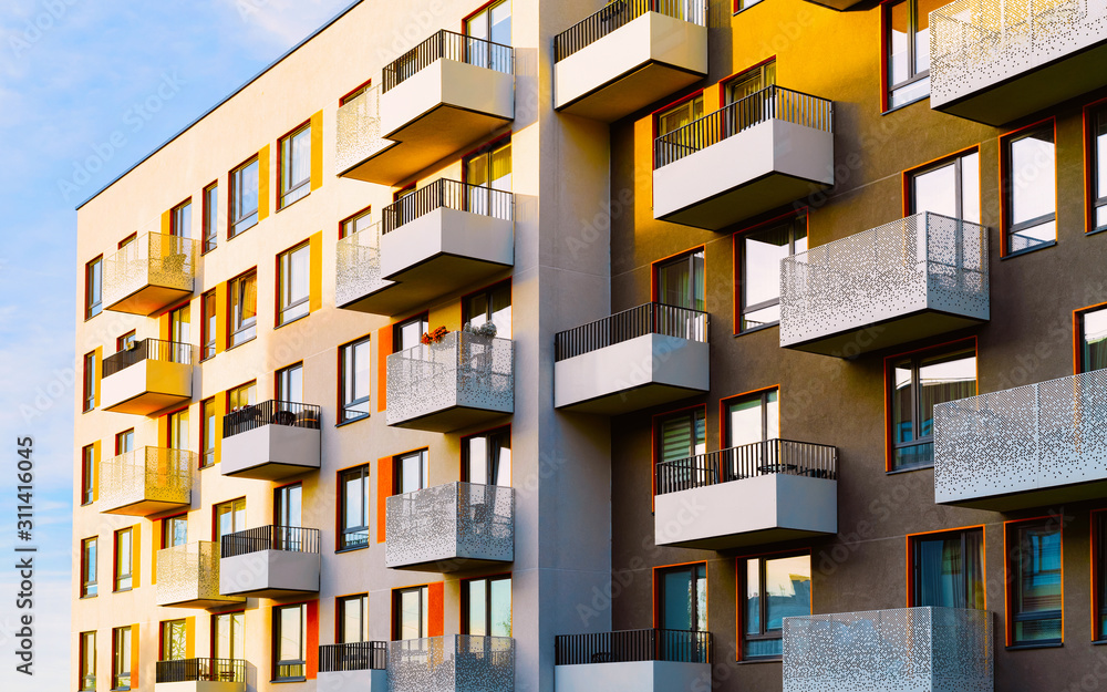 Apartment in residential building exterior. Housing structure at blue ...