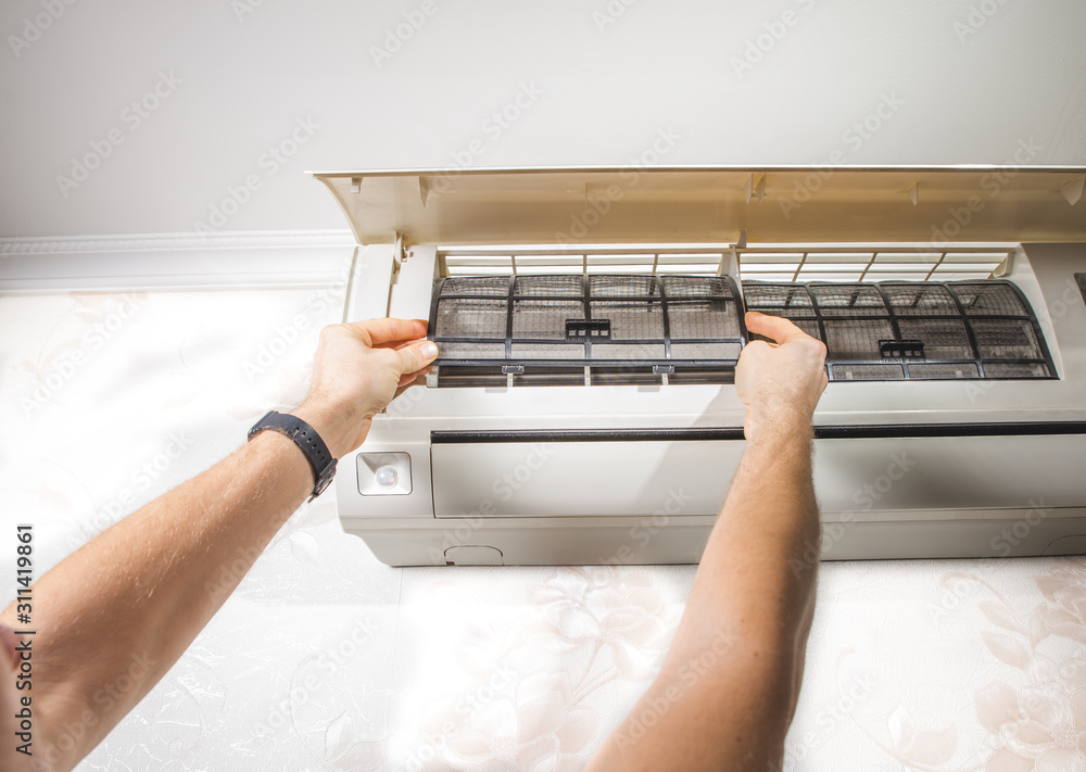 Close-up outdoor air condition unit with clogged obstructed compressor ...