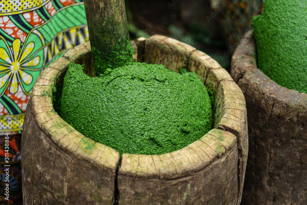 Preparing Isombe inside a trunk, a traditional dish from DR Congo ...