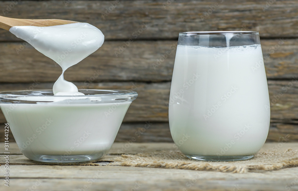 Glass cup of Turkish traditional drink ayran , kefir or buttermilk made ...