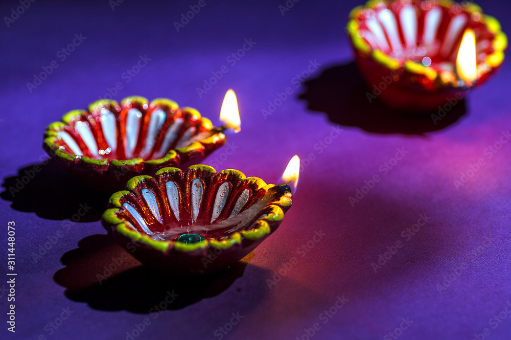 Clay diya lamps lit during Diwali Celebration. Greetings Card Design ...