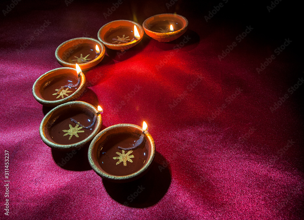 Clay diya lamps lit during Diwali Celebration. Greetings Card Design ...