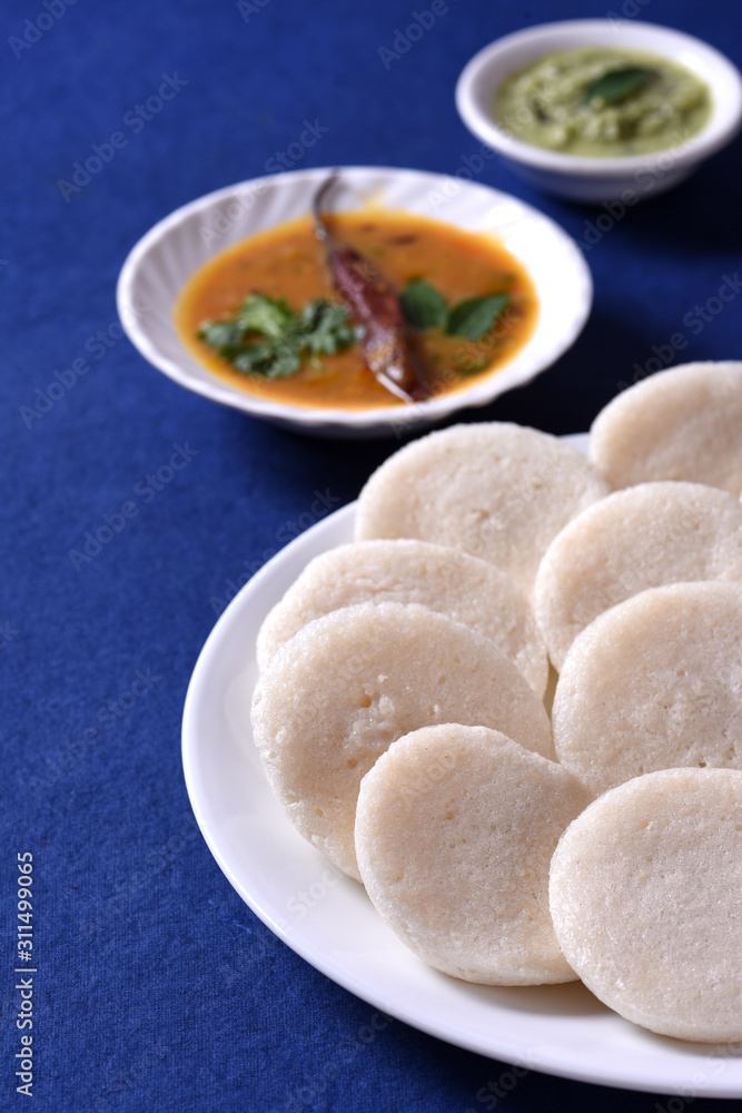 Idli with Sambar and coconut chutney on blue background, Indian Dish ...