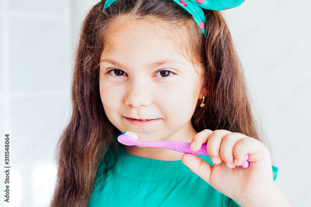little girl brushing his teeth with a toothbrush dentistry tooth Stock ...