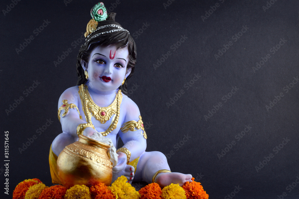 Hindu God Krishna on dark background Stock Photo | Adobe Stock