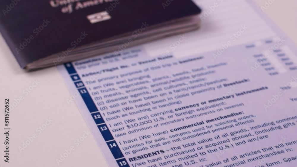 American passport with customs declaration form on a white background ...