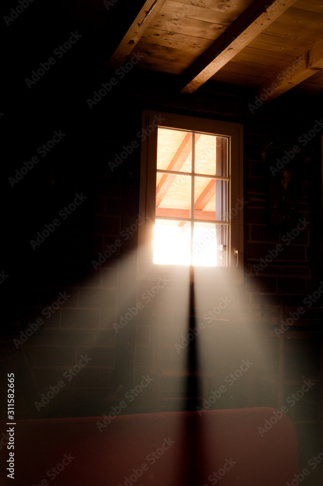 Basement windows in wooden cabin house. Light beams passing through ...