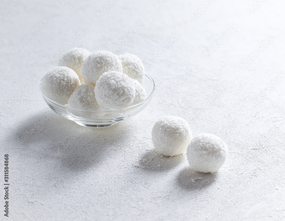 essert curd balls in coconut shavings on a light white background Stock ...
