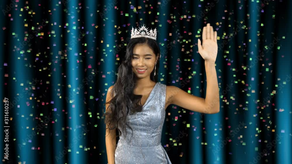 Miss beauty pageant Asian woman winner stands in front of the stage ...