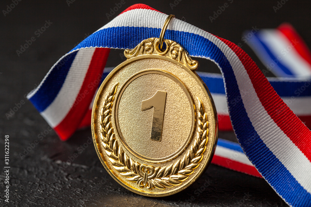 Gold medal with ribbons. Award for first place in the competition ...
