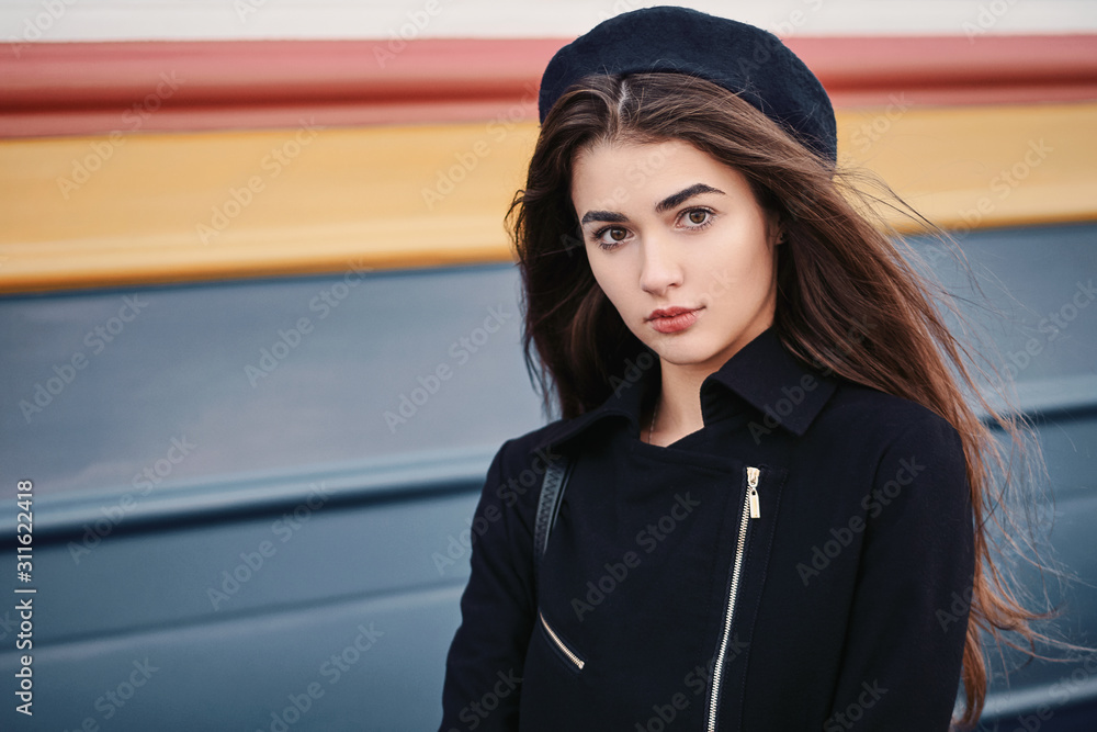 Young Beautiful Brown Haired Woman In Black Jacket Blue Skirt With
