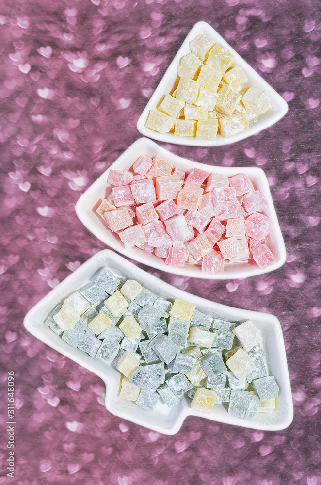 Colorful dessert Turkish delight in a plate in the shape of a Christmas ...