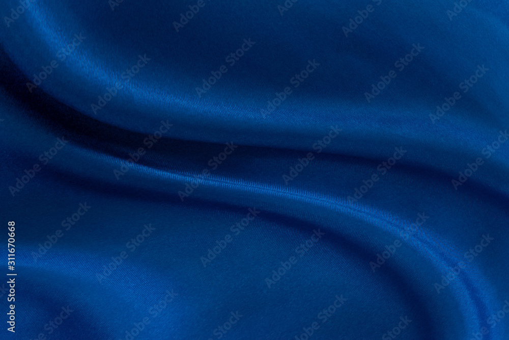 Luxury deep blue fabric background.Smooth wavy fold pattern.Elegant ...
