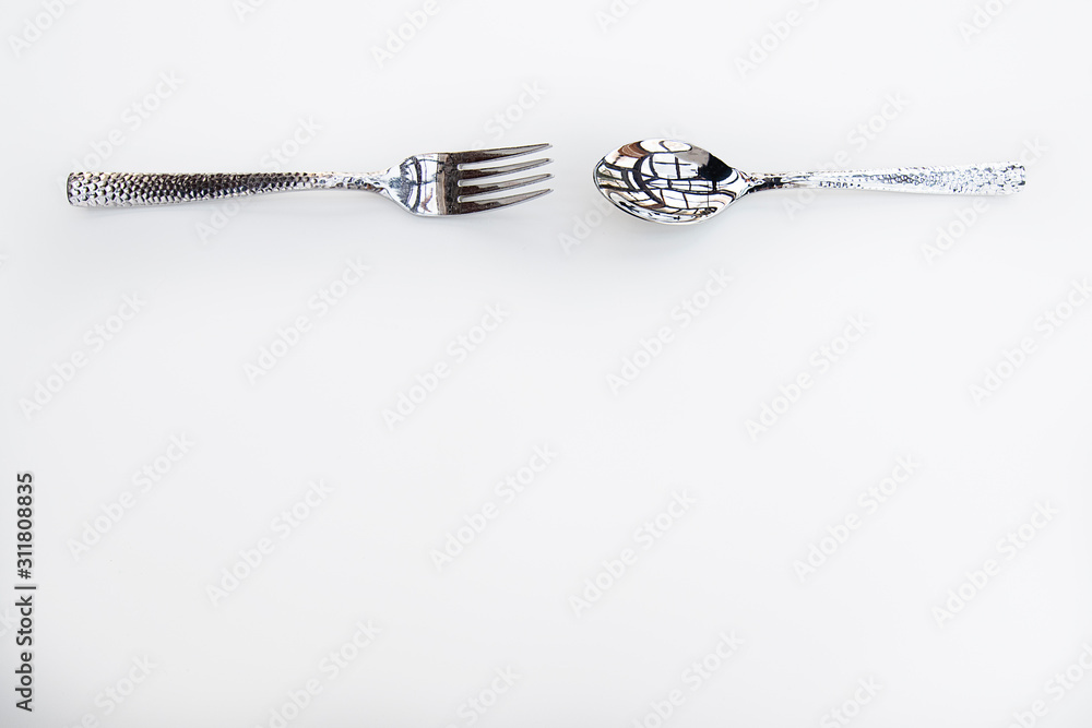 Spoon and Fork facing each other on a white background Stock Photo ...