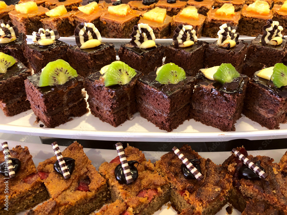 Lots of different beautiful chocolate brownies at a buffet in a ...