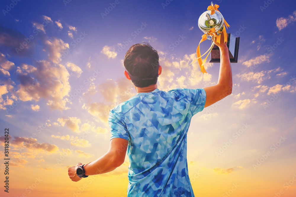 Silhouette marathon runner hand holding finisher trophy award celebrate ...