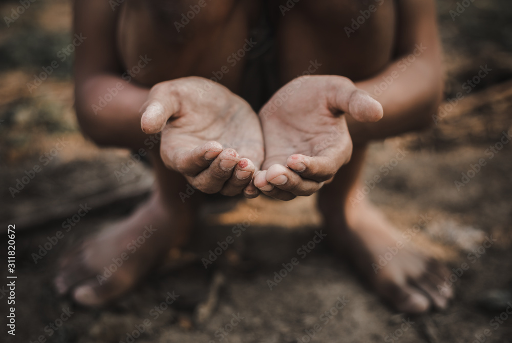 poor child or beggar begging you for help sitting at dirty slum ...