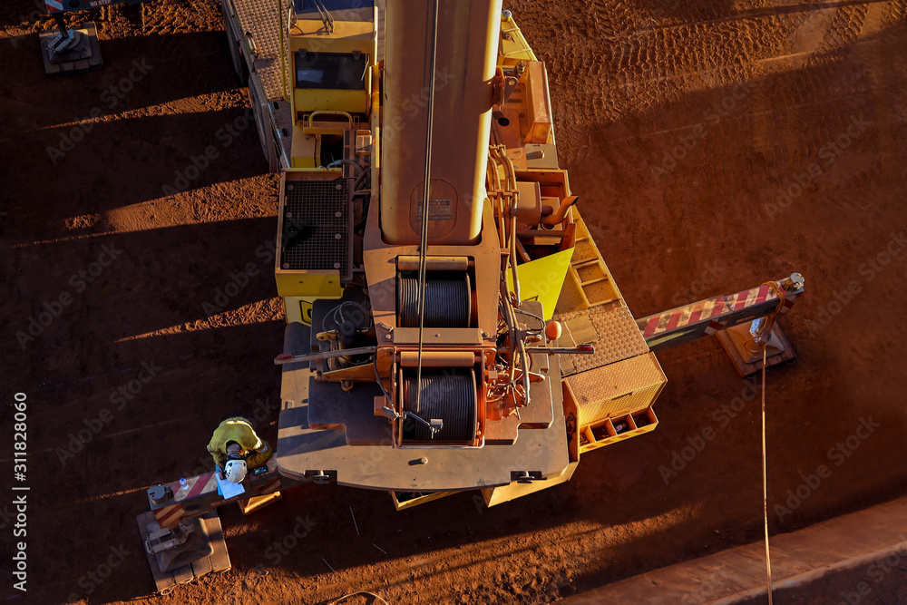 Top view of crane operator wearing safety hard hat visible T-shirt ...