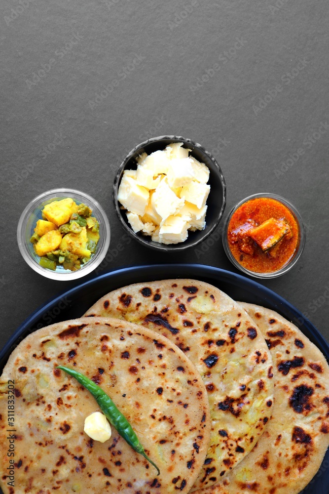 Indian Food - Aloo Paratha or Indian Potato stuffed Flatbread. Served ...