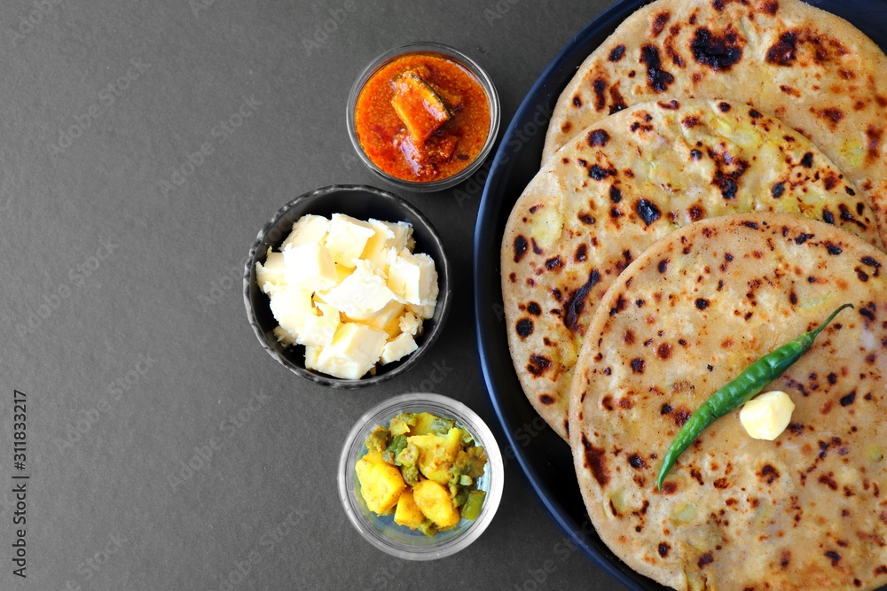 Indian Food - Aloo Paratha or Indian Potato stuffed Flatbread. Served ...