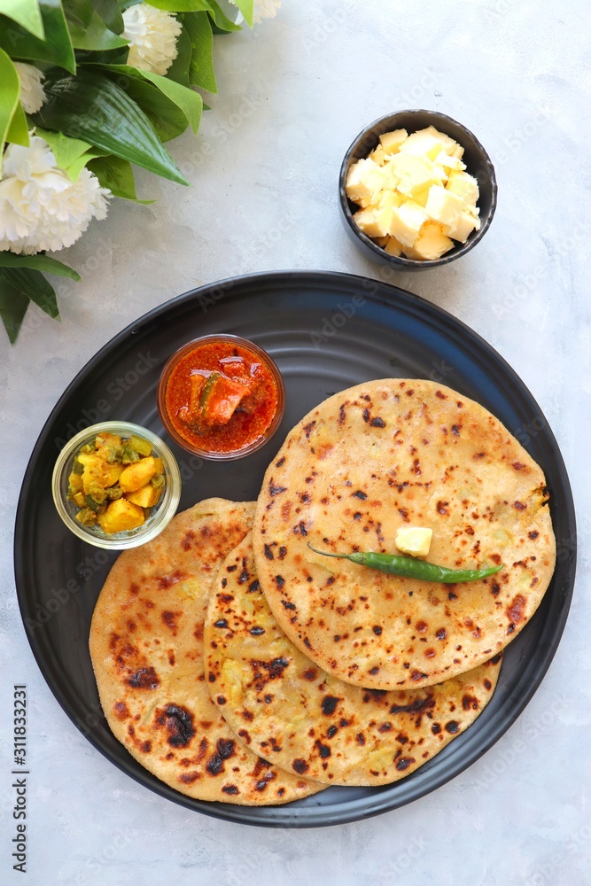 Indian Food - Aloo Paratha or Indian Potato stuffed Flatbread. Served ...