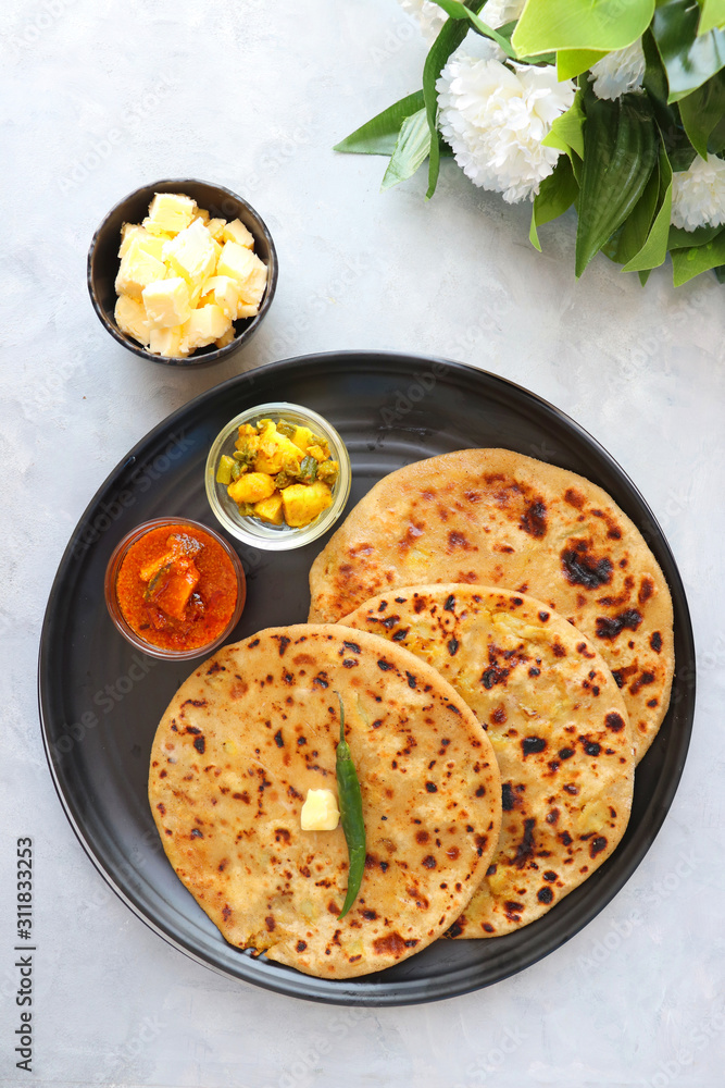 Indian Food - Aloo Paratha or Indian Potato stuffed Flatbread. Served ...
