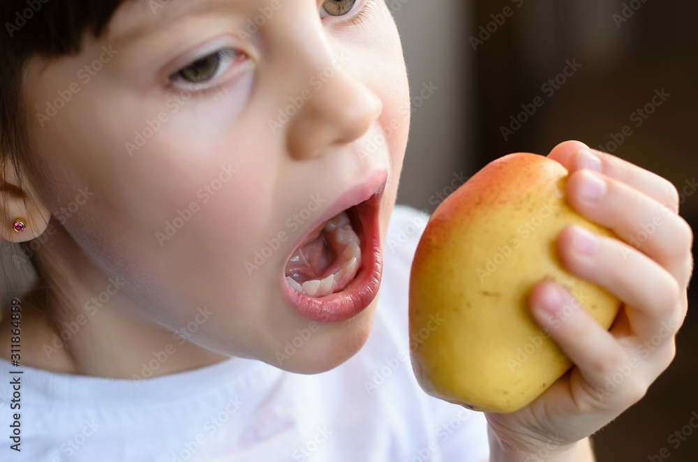 Beautiful smiling preschool girl with her first adult incisor tooth and ...