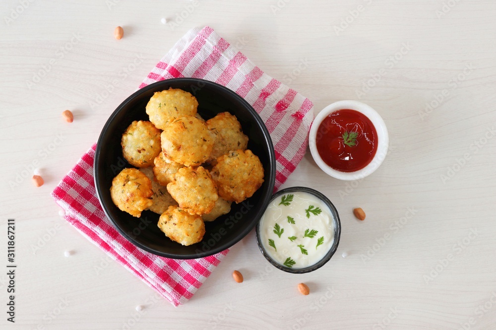 Sabudana vada or Sago fried fitters served with Curd or yogurt and ...