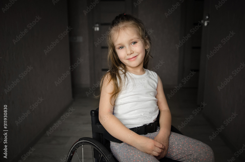 Beautiful sad girl child disabled child sitting in a wheelchair ...