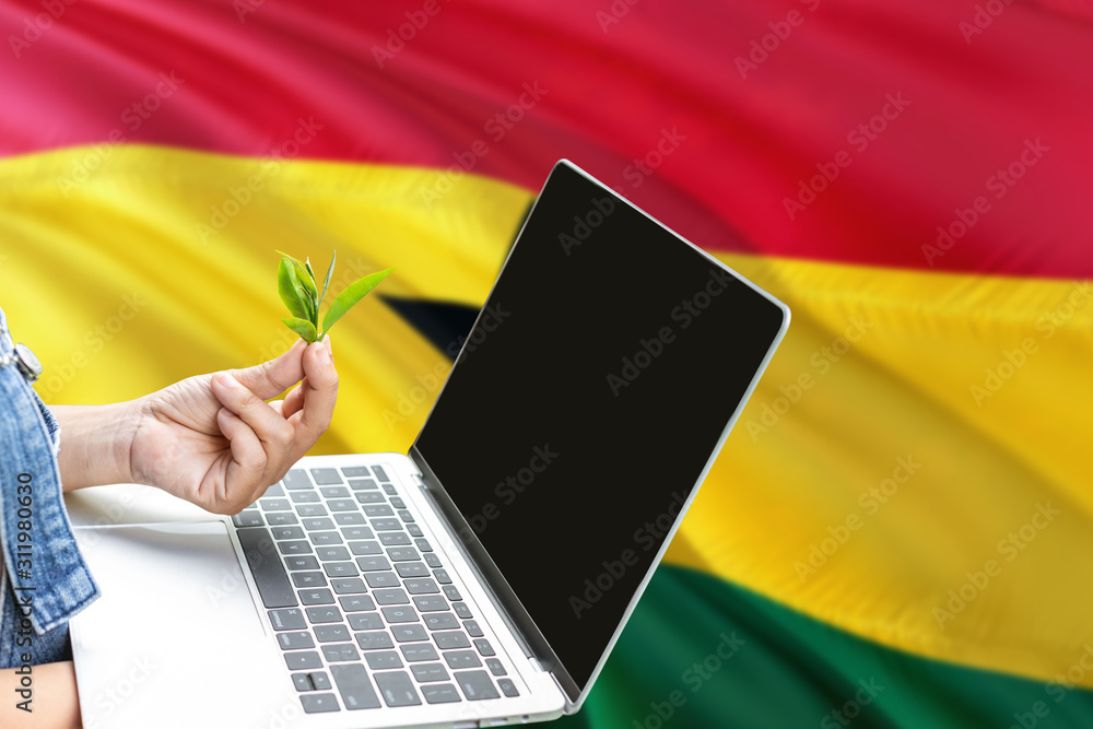 Ghana modern agriculture concept. Farmers holding laptop, check tea on ...