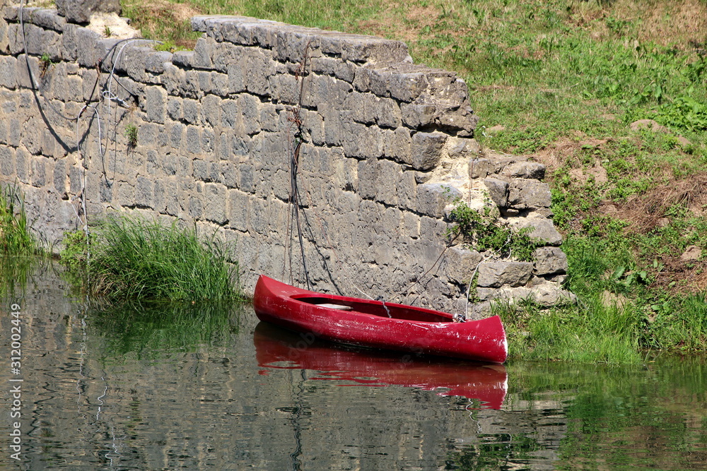 Old Canoe On River
