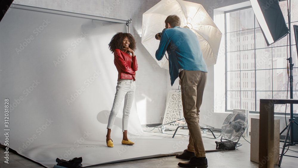 Beautiful Black Model Posing for a Photographer, he Takes Pictures with ...