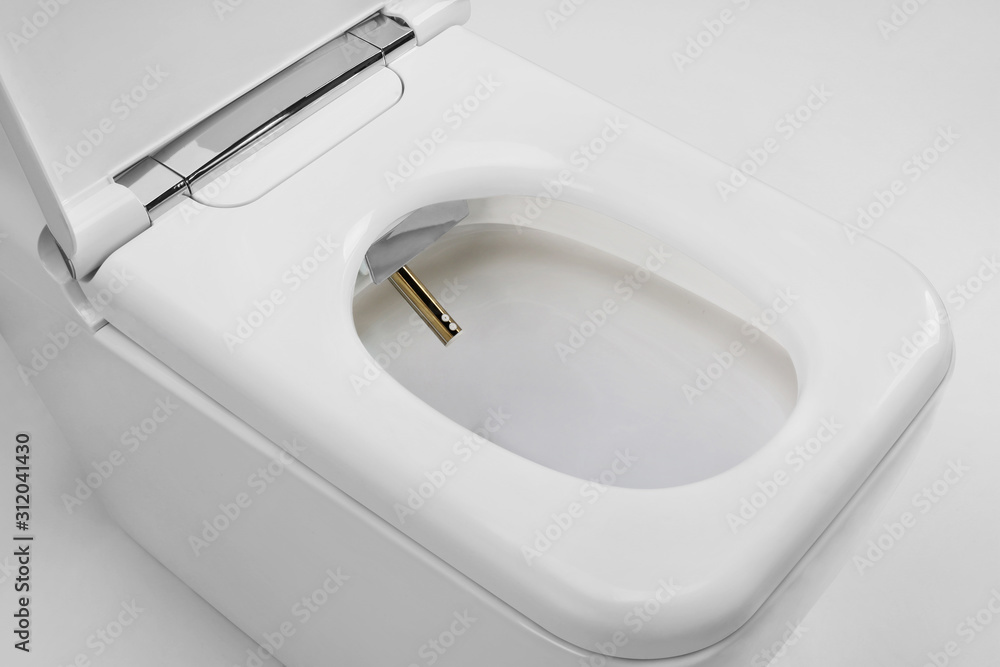 Toilet bowl with electronic high technology. Close-up of toilet bowl ...