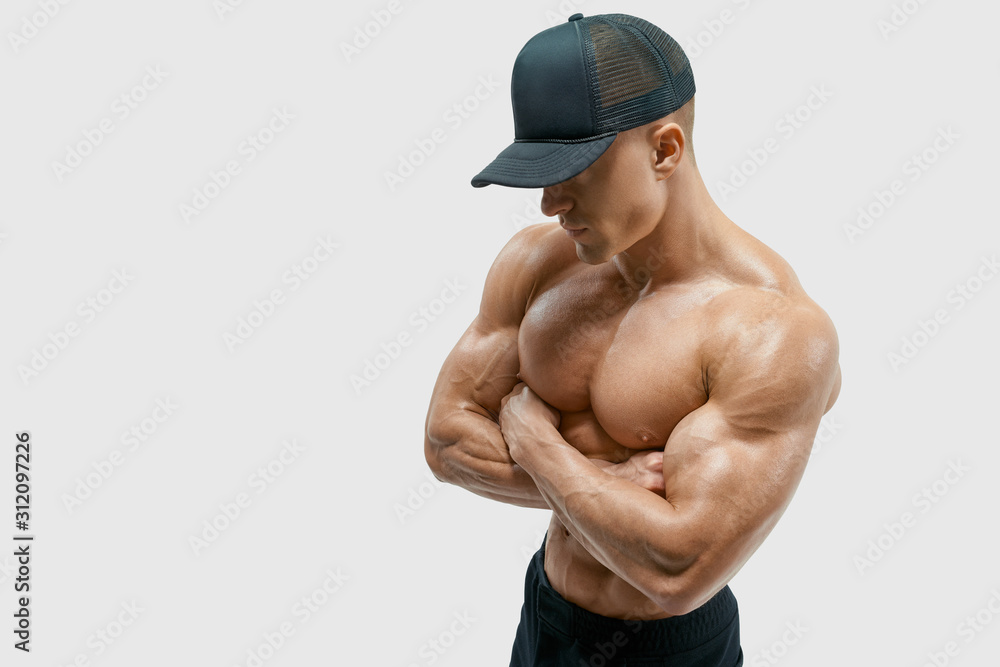 Shot of healthy muscular young man with black beseball cap. Perfect fit ...